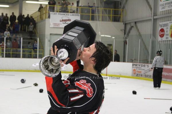 Kissing trophy - Fort Frances Times