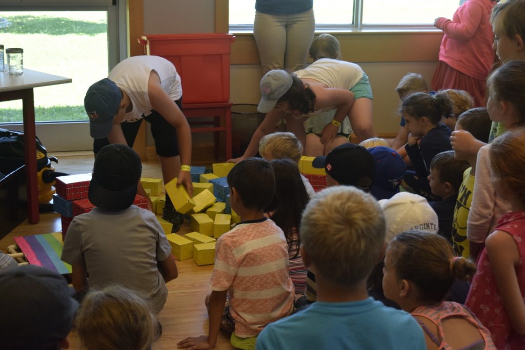 Arranging boxes - Fort Frances Times